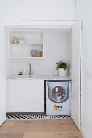 Laundry before and after: Dreamy Euro style laundry behind pocket doors