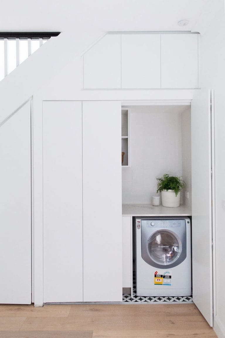 Laundry before and after: Dreamy Euro style laundry behind pocket doors