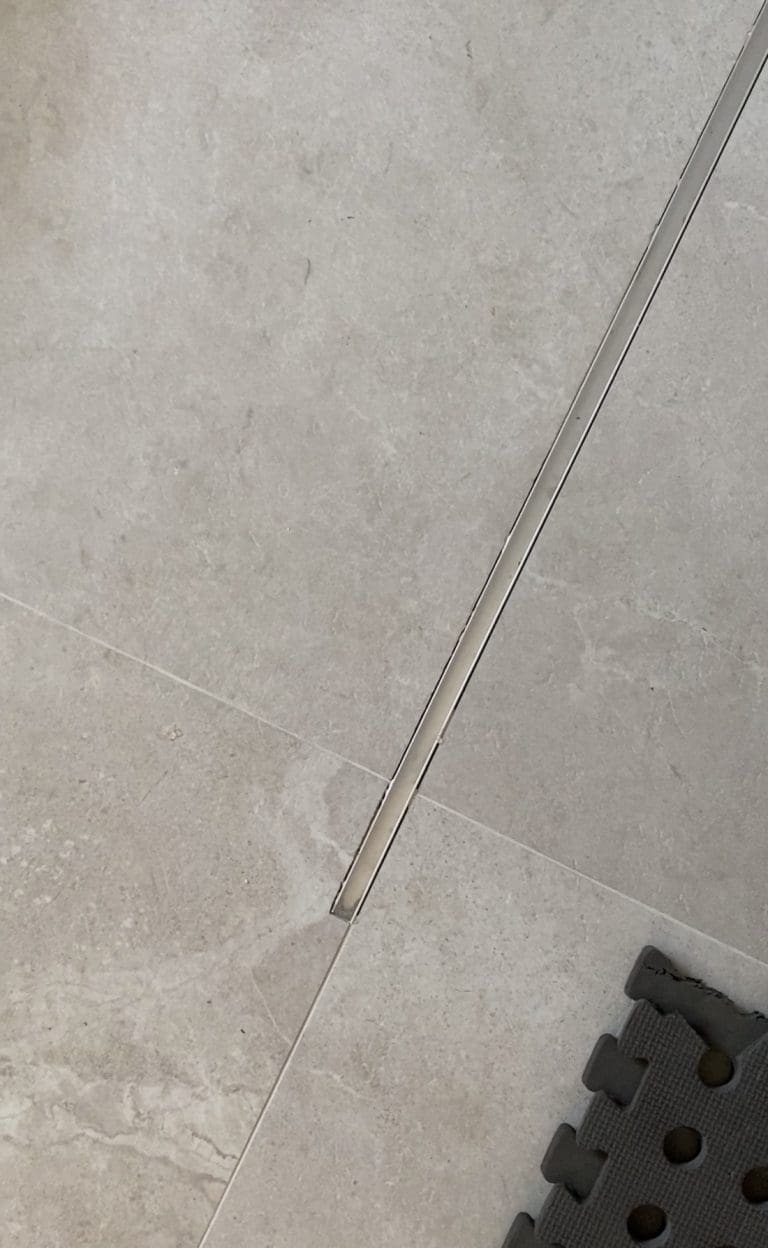 How we installed a glass floor to ceiling shower screen | Style Curator