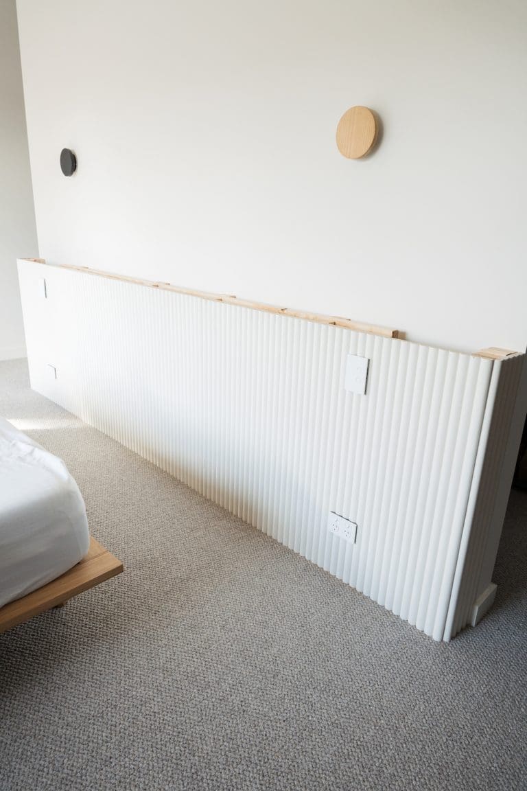 How to build a ledge wall: Convex and pink terrazzo shelf wall