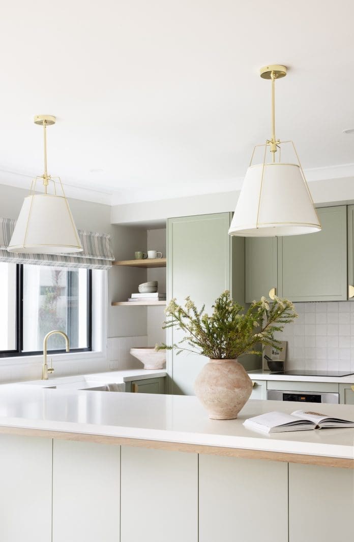 Modern farmhouse kitchen featuring gorgeous green cabinetry | Style Curator