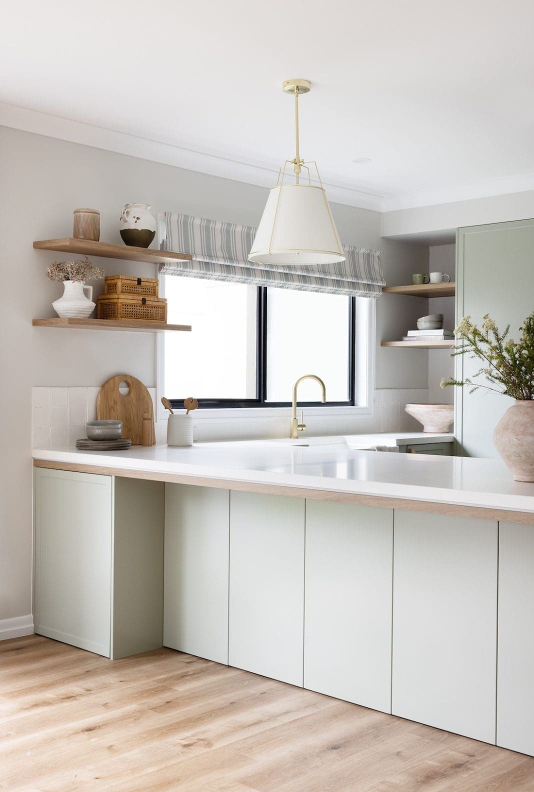 Modern farmhouse kitchen featuring gorgeous green cabinetry | Style Curator