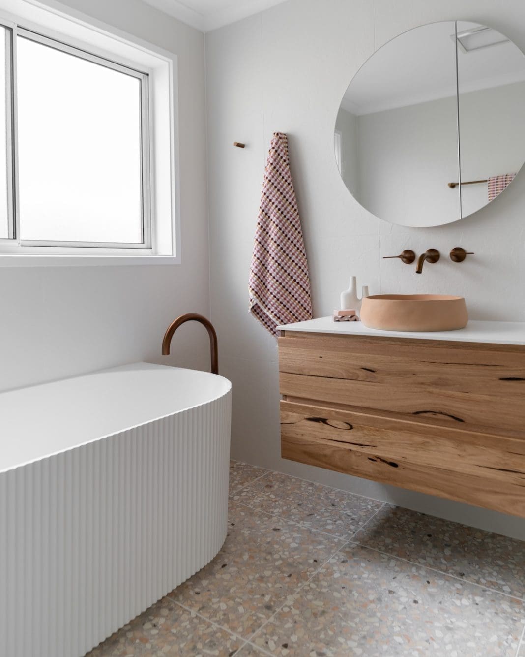 Peachy terrazzo floor tiles and brushed bronze tapware bathroom | Style ...