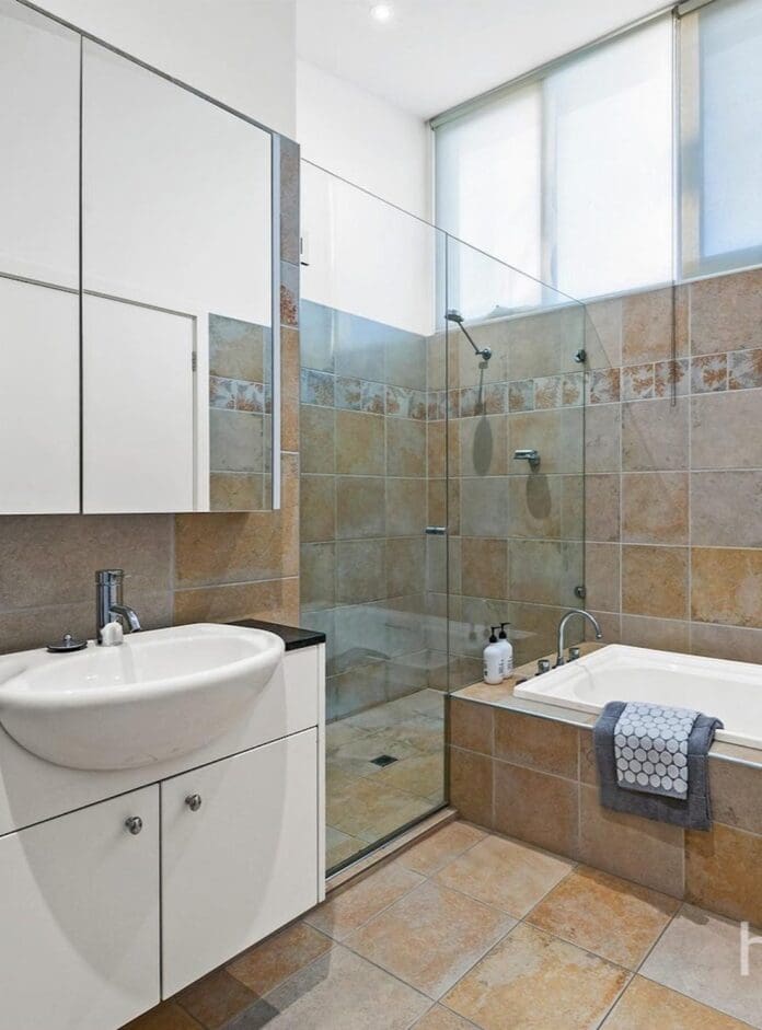 Walnut joinery, kitkat tiles & luxe accents: A forever living coastal ...